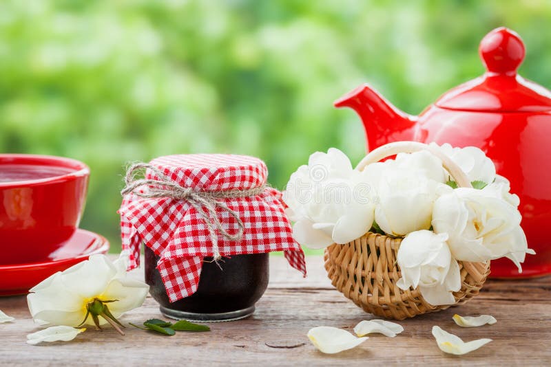 Red Teapot, Jars of Jam, Basket with Roses Bunch Stock Photo - Image of ...