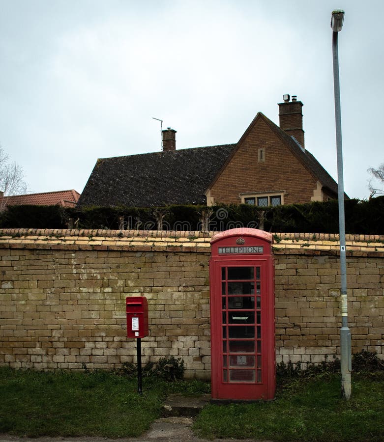 A Red Telephone Box Next To a Red Post Box Editorial Photo - Image of ...