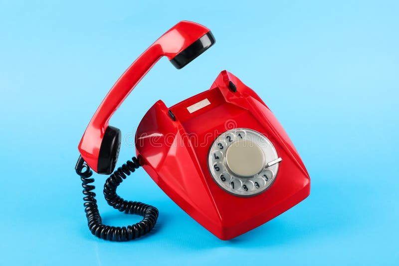 Red Telephone with Handset on Light Blue Background Stock Image - Image ...