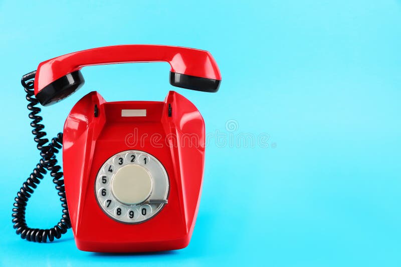 Red Telephone with Handset on Light Blue Background, Space for Text ...