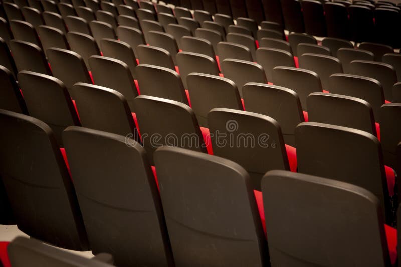 Red theater seats in rows stock image. Image of conference - 298559907