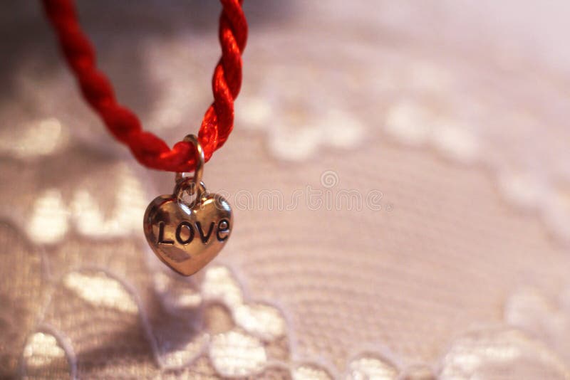 Red Thread on Hand with a Heart of Gold Stock Image - Image of ornament ...
