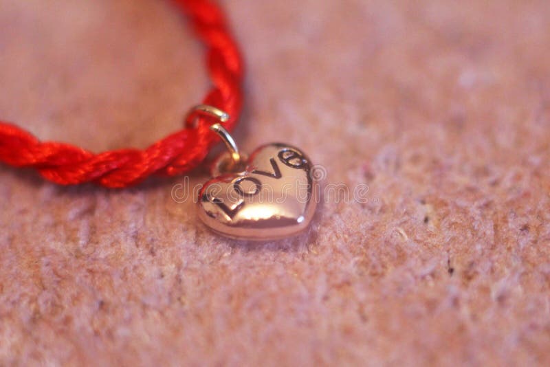 Red Thread on Hand with a Heart of Gold Stock Image - Image of ...