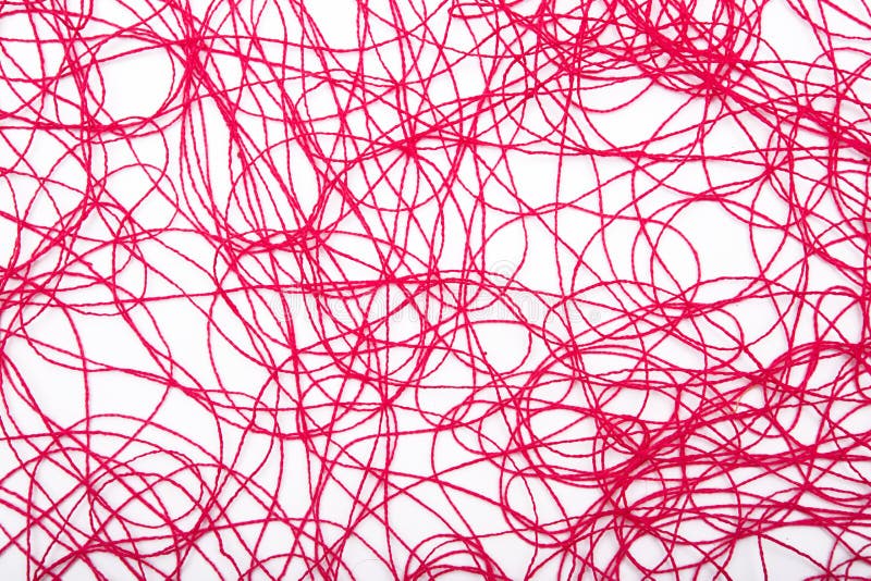 An Unwound Ball of Thread, the Thread Forms a Heart on a White ...