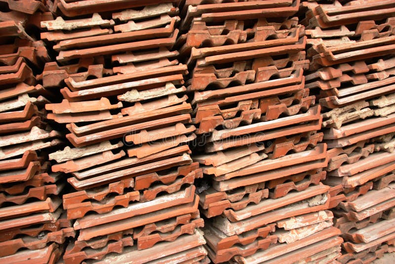 Red tiles stacked in lines stock image. Image of construction - 9954163