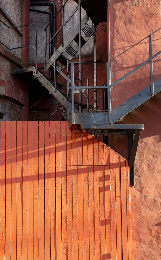 Red Timber Wall with Black Iron Stairs Stock Photo - Image of history ...