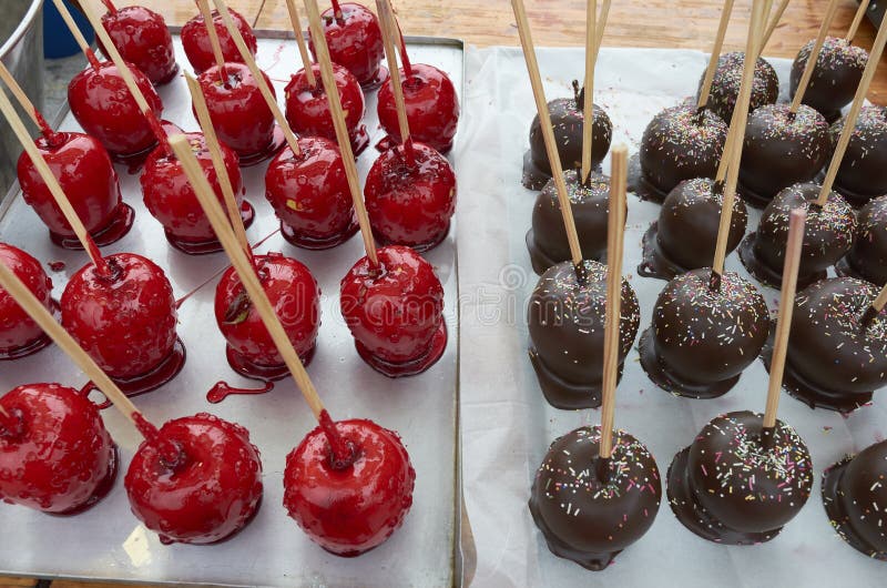 Red Toffee Apples and Melted Chocolate Covered Apples. Stock Image ...
