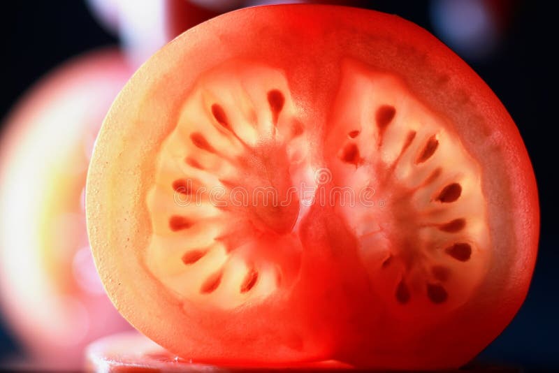 Red Tomato Cut in Half with the Texture of Seeds Stock Photo - Image of ...