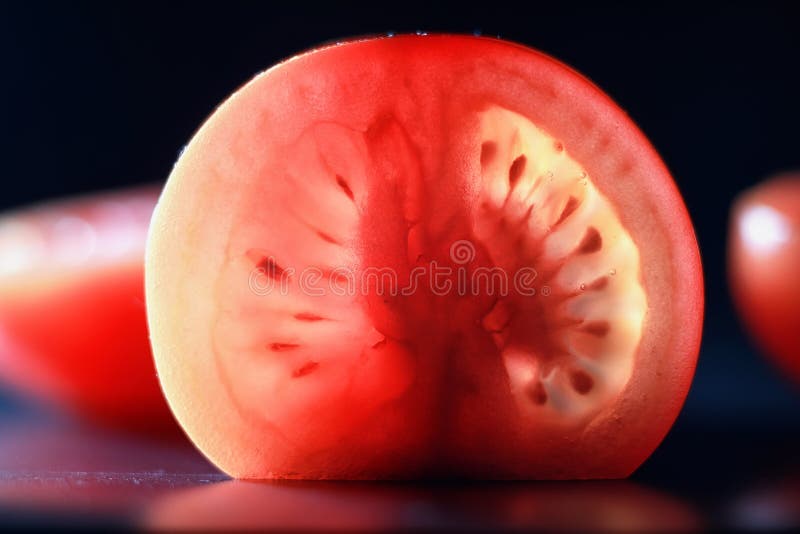Red Tomato Cut in Half with the Texture of Seeds Stock Photo - Image of ...