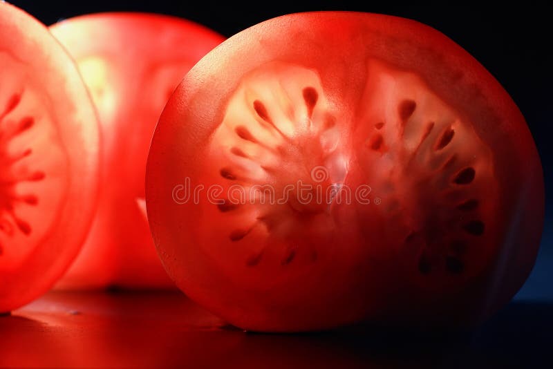 Red Tomato Cut in Half with the Texture of Seeds Stock Photo - Image of ...