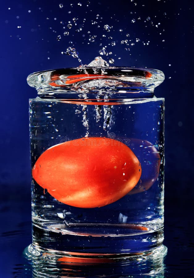 Red Tomato Falling Down in Glass with Water Stock Photo - Image of ...