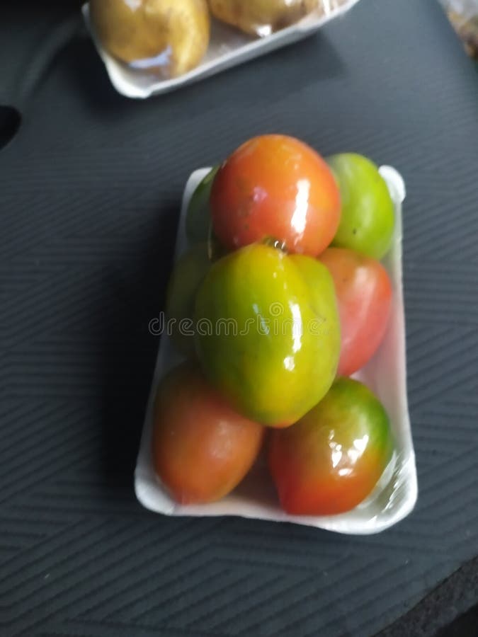 Red tomato by pack stock image. Image of yellow, gourd - 265850217