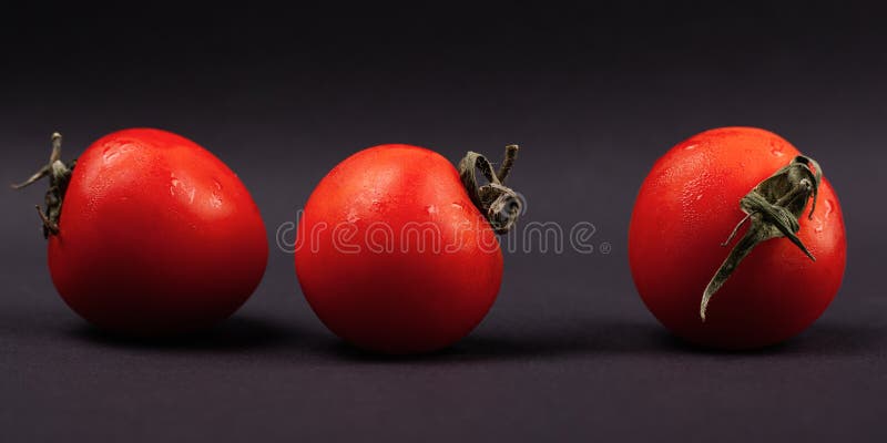 Red Tomatoes on a Dark Background Close-up, Panoramann Stock Photo ...
