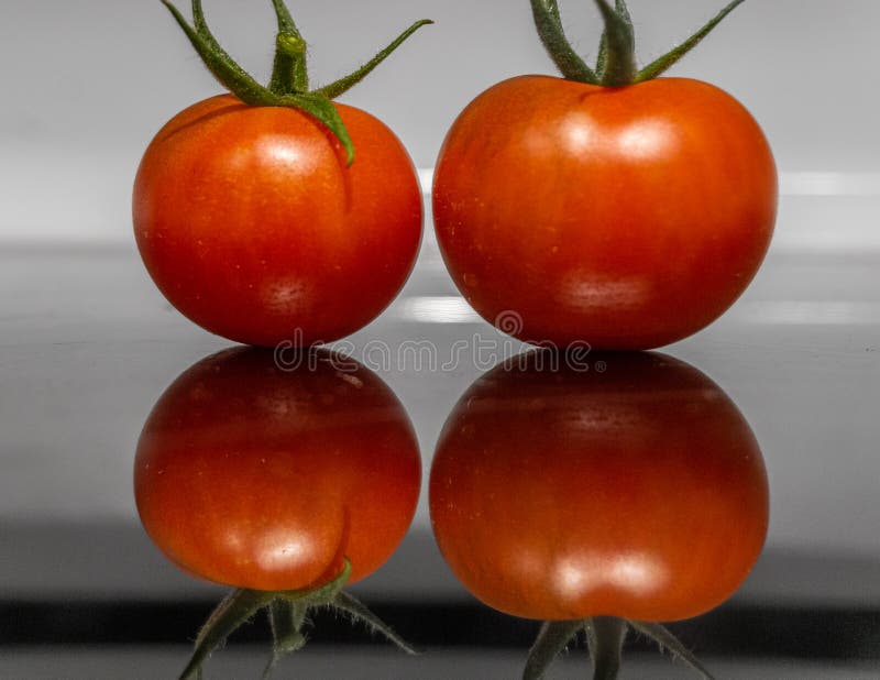 Red Tomatoes on Reflective Surface Stock Image - Image of surface ...