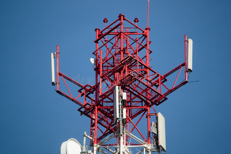 Red Tower with Mobile Antennas on a Blue Sky Background Stock Image ...