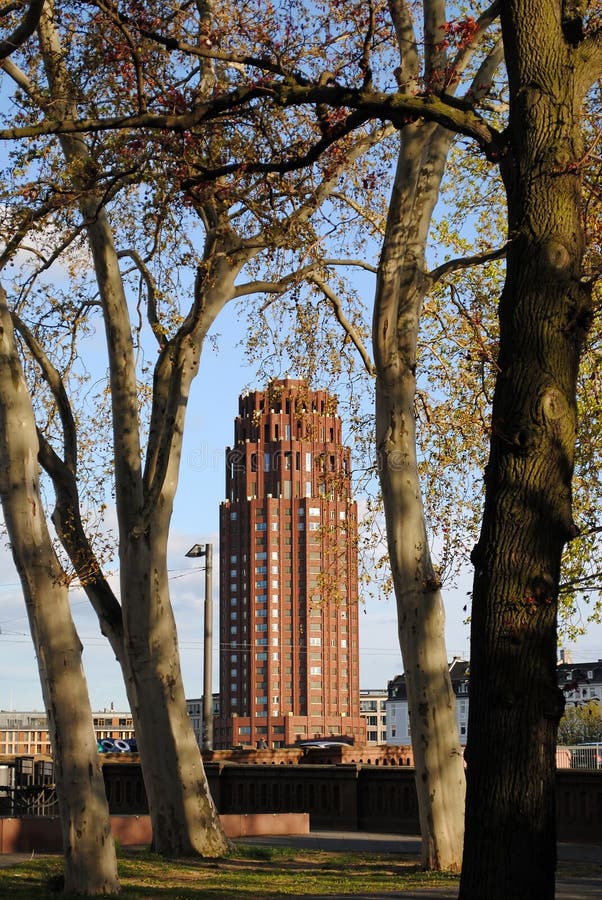 Red Tower Seen through Trees Stock Image - Image of cloud, construction ...
