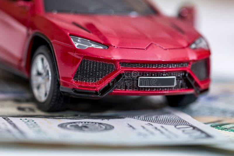 Red toy car with money stock image. Image of business - 109373823
