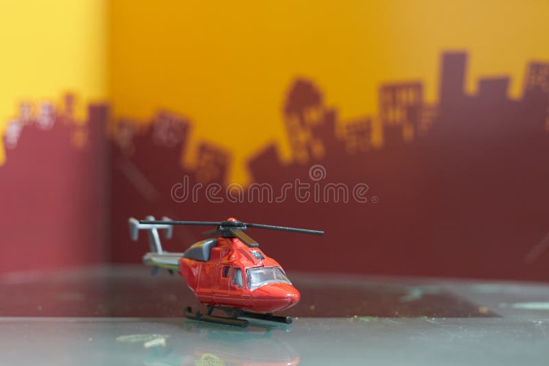 Red Toy Single Blade Helicopter on Blur City Background Stock Photo ...