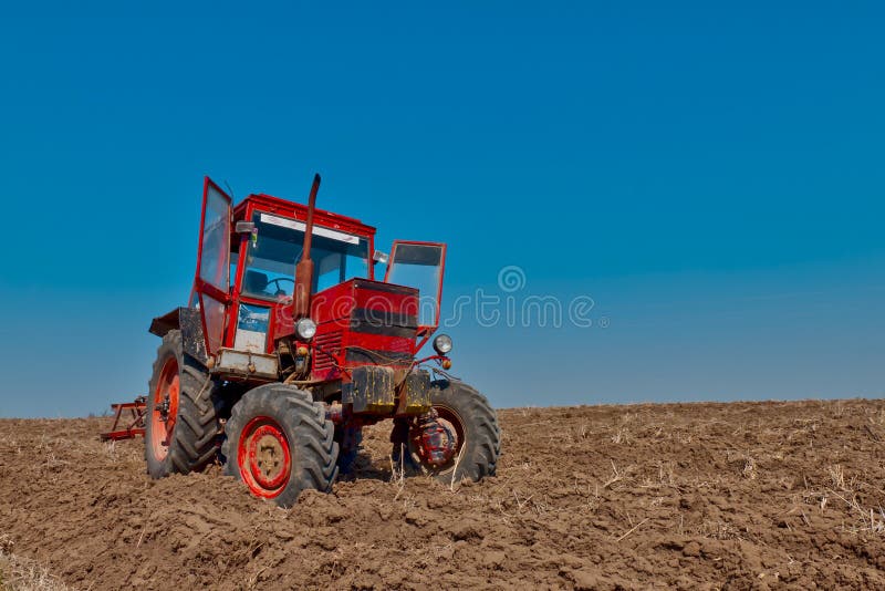 Red tractor stock image. Image of cultivation, plowing - 23983533