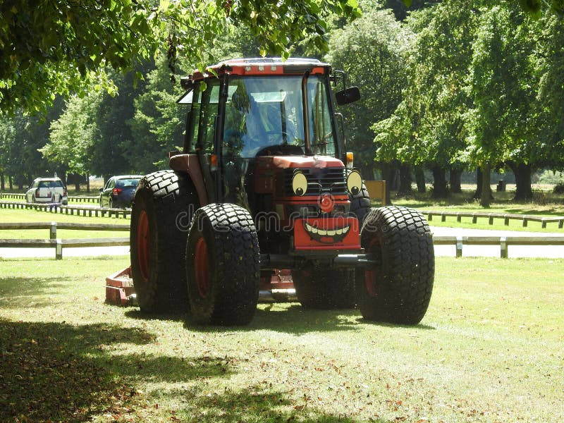 Smiling Tractor in the Park Stock Image - Image of smiling, cutting ...