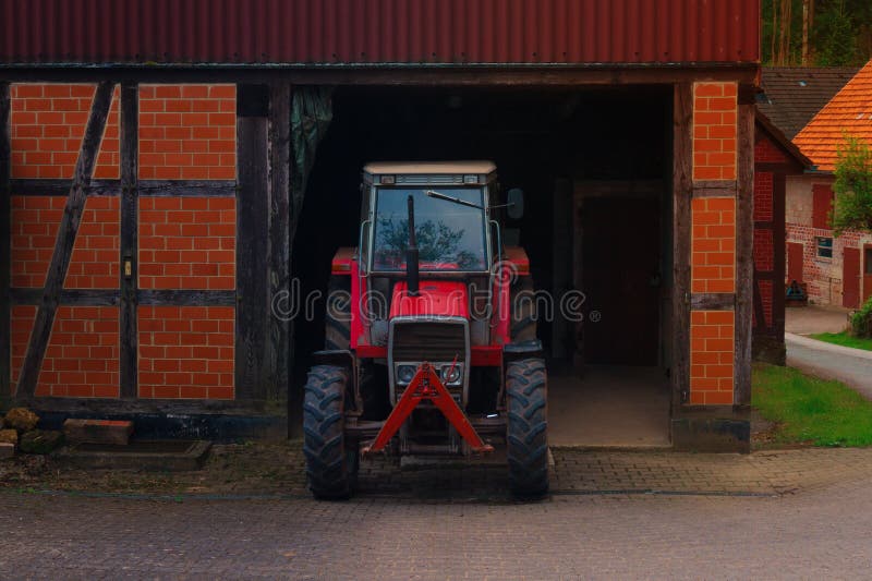 Red tractor on the farm stock image. Image of farmyard - 92595311