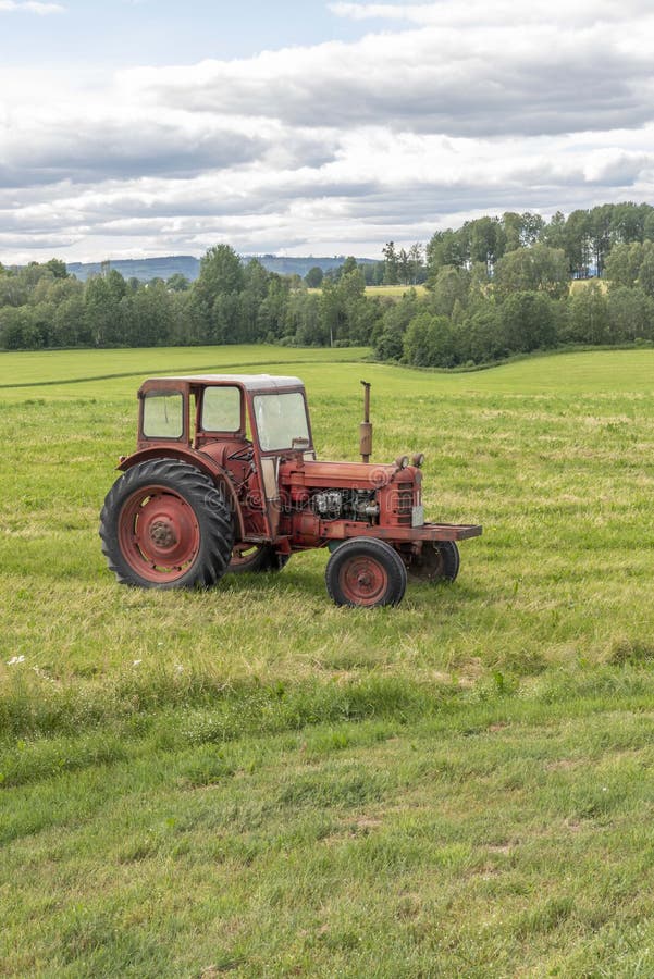 Red Tractor in Farming Landscape Stock Photo - Image of tractor, field ...