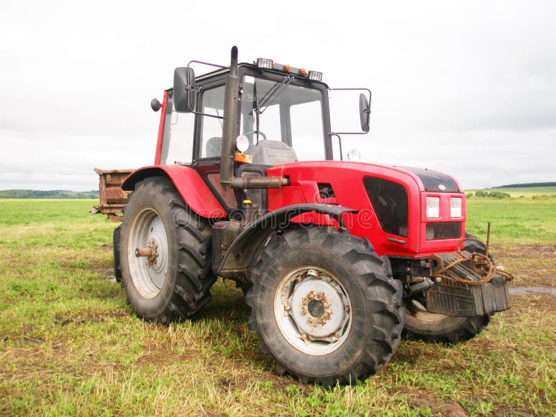 Red tractor in the field stock photo. Image of tractor - 34084318