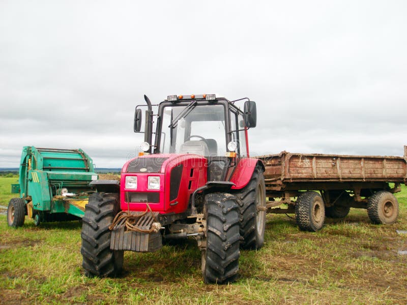 Red tractor in the field stock photo. Image of tractor - 34084318