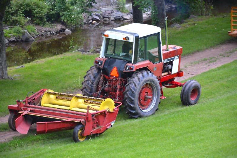 Red Tractor Pulling Disco Across Dirt Path Stock Photo - Image of ...