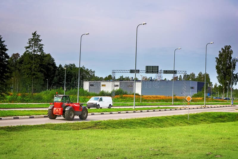 Red Tractor on the Road in Estonia Stock Photo - Image of land ...