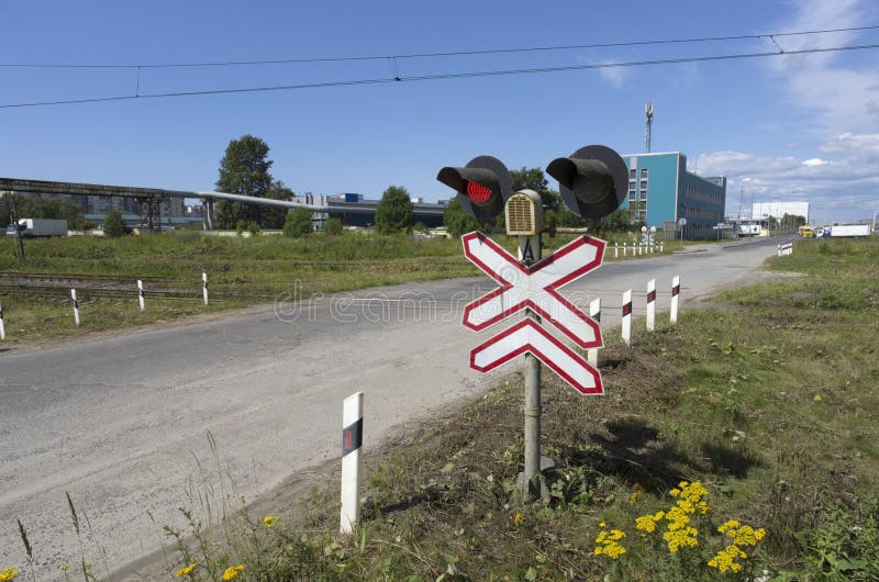 Red Traffic Light at the Crossroads of the Road and the Railway Stock ...