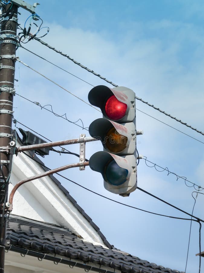 Red Traffic Light Over Urban Intersection. Stock Photo - Image of ...