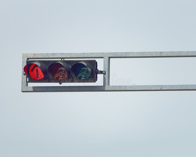 Ed Traffic Light on a Pole Against a Gray Sky Stock Image - Image of ...