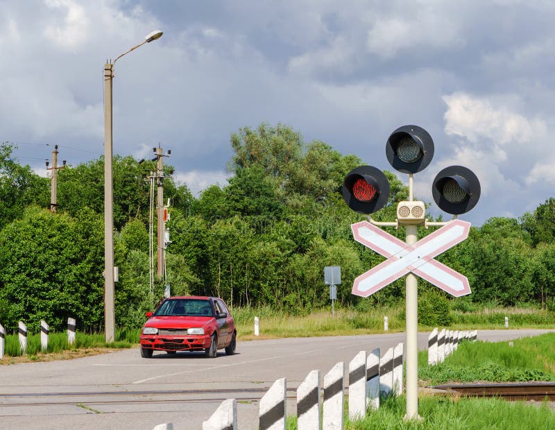 Red Traffic Light at the Railway Crossing. Car in Front of a Railway ...