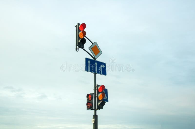 Red Traffic Light and Road Signs Against the Sky Stock Photo - Image of ...