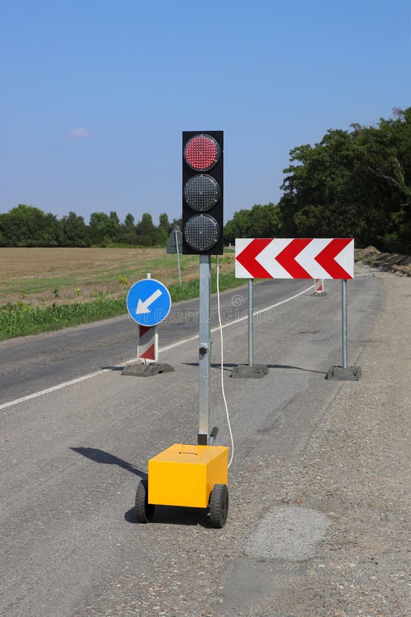Red Traffic Light and Road Works Stock Photo - Image of line, sign ...