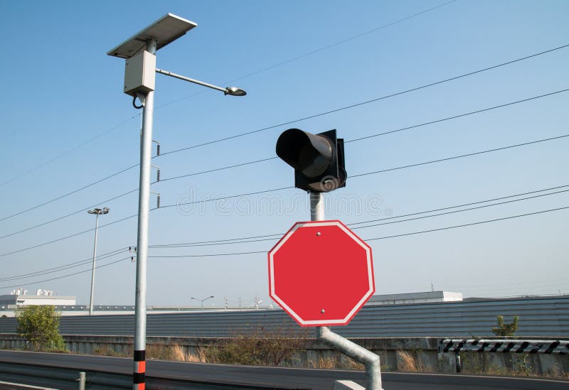Red Traffic Sign with the Traffic Light Near by a Solar Lamp Stock ...