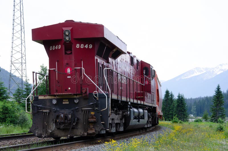Red Train Driving through the Rockies Stock Photo - Image of canada ...