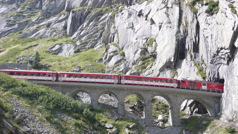 Red train editorial photo. Image of bridge, tonnel, mountain - 49075571