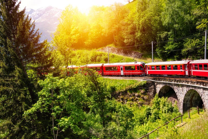 Red Train Moving in Beautiful Green Summer Forest in Switzerland Stock ...