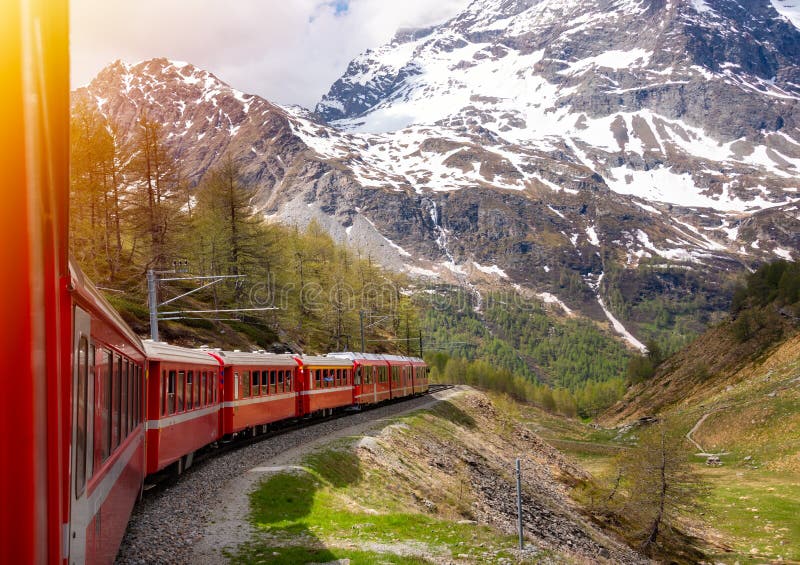 Red Train Moving in Beautiful Green Summer Forest in Switzerland Stock ...