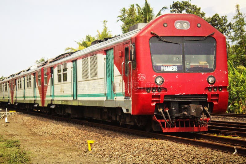 Red Train Passing by in a Sunny Day Editorial Photo - Image of railroad ...