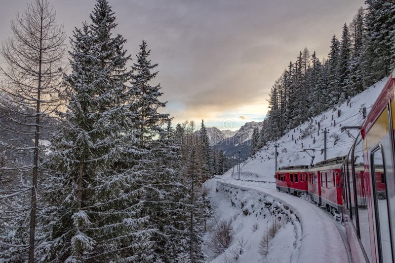 Red Train in the Snow in Swiss Alps Stock Photo - Image of ...