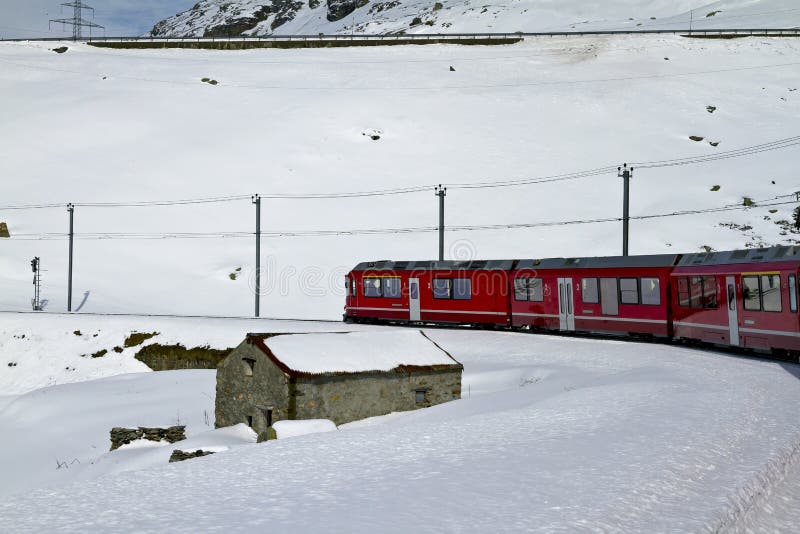 Red train and snow valley stock image. Image of slope - 26576343