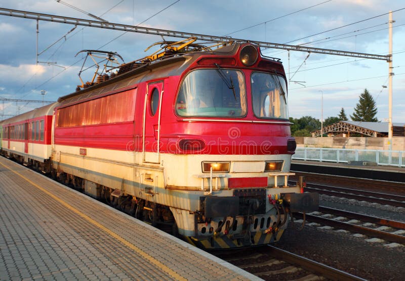 Red train under blue sky. stock image. Image of route - 20286483