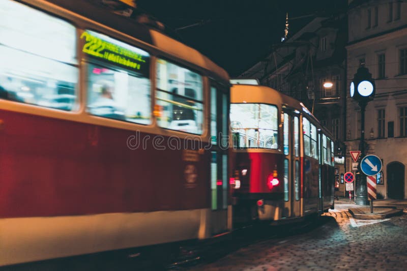 Red Tram in Motion on City Street at Night Editorial Photography ...