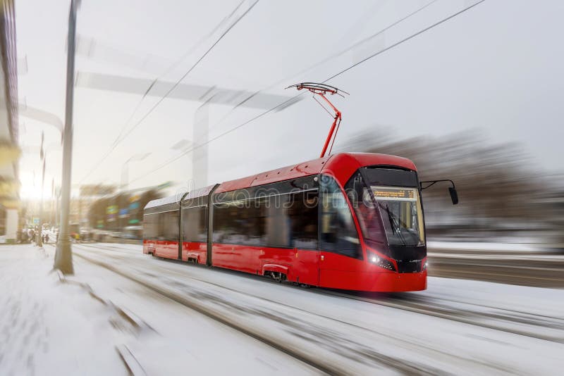 Red Tram Rushes through the City in Winter Motion Blur Effect Stock ...
