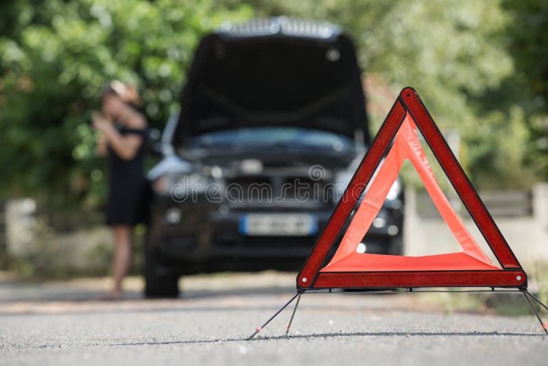 Red triangle car on road stock photo. Image of accident - 197917996