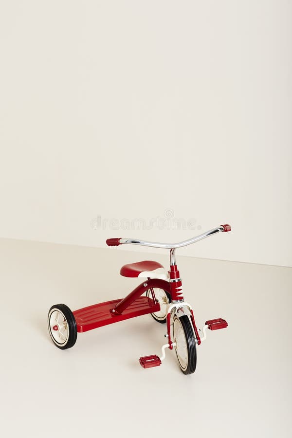 Red tricycle in studio stock photo. Image of vertical - 50781786