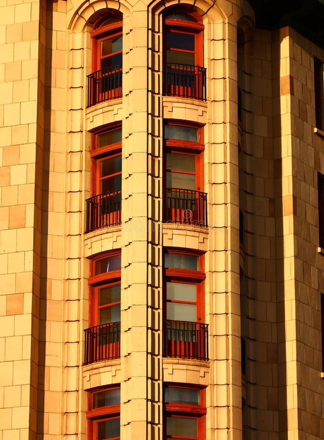 Red Trim Windows on Stone Building with Green Trim Stock Image - Image ...